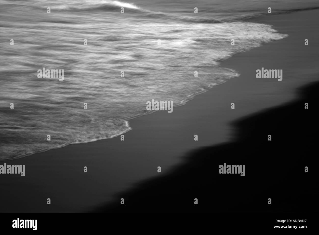 Beach, ocean, sea. Wave in movement. Volcanic Stock Photo - Alamy