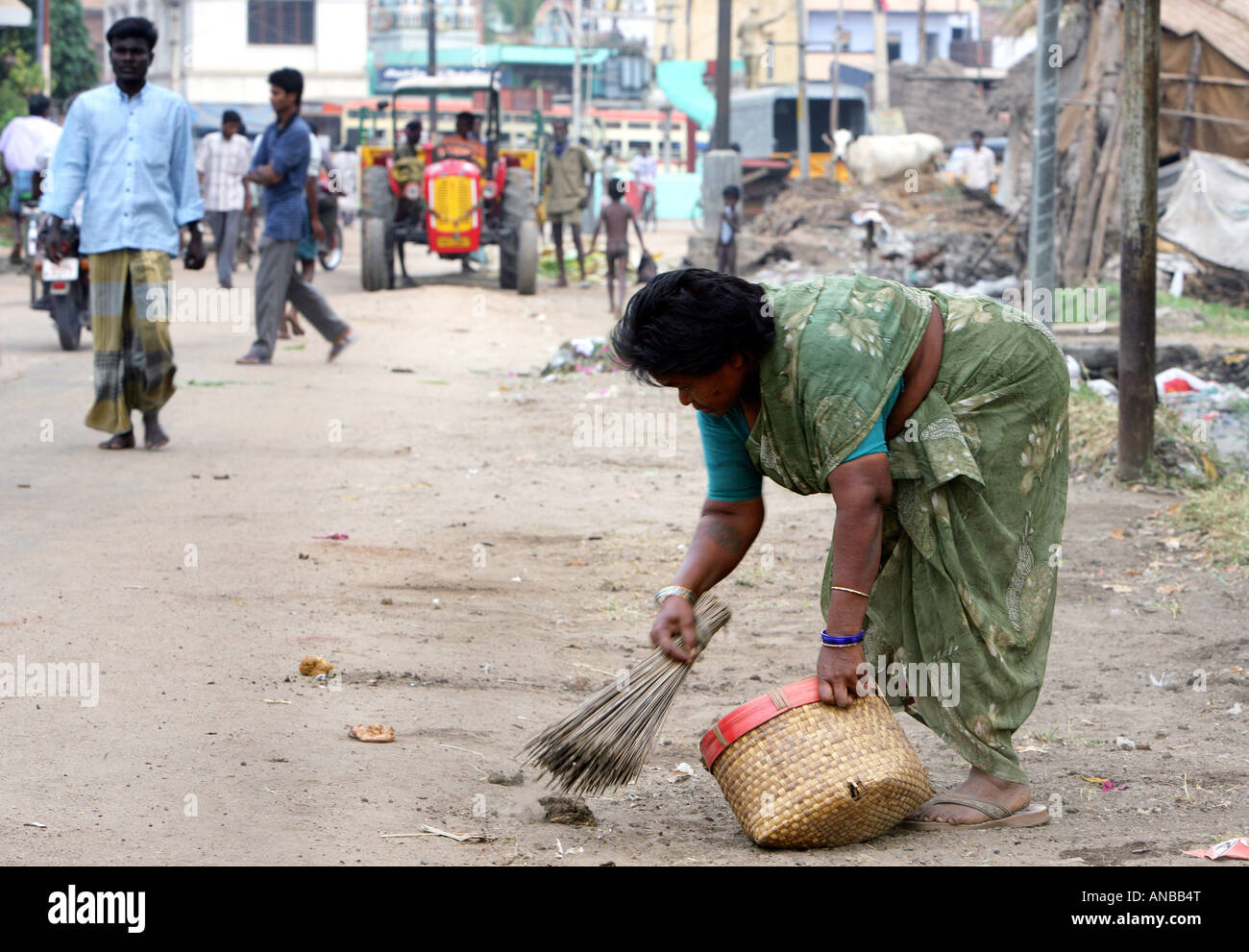 India: scavenger women from the cast of the untouchables cleaning ...