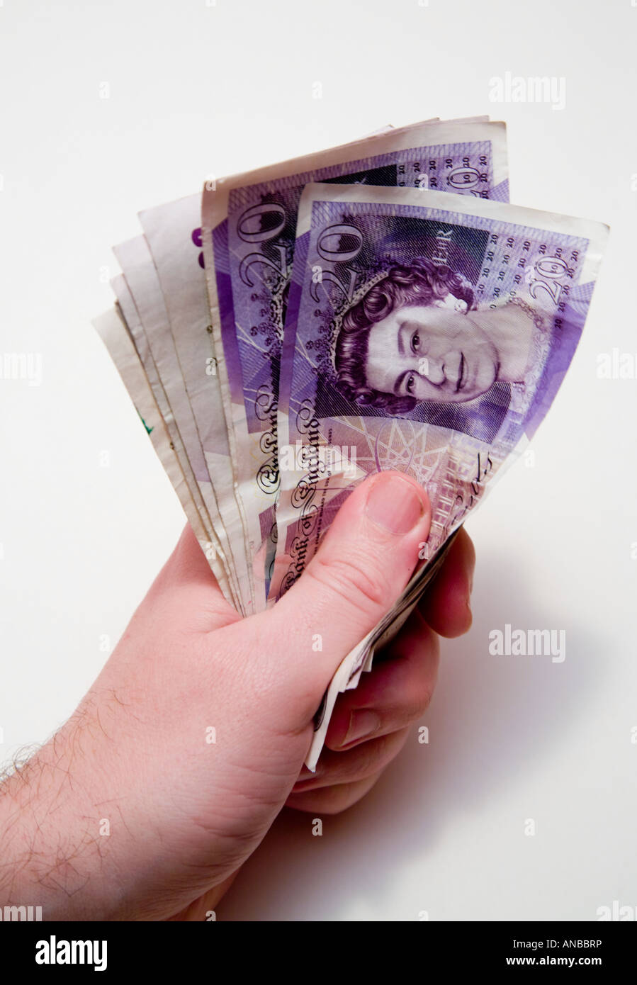 UK Money held in a hand Stock Photo - Alamy