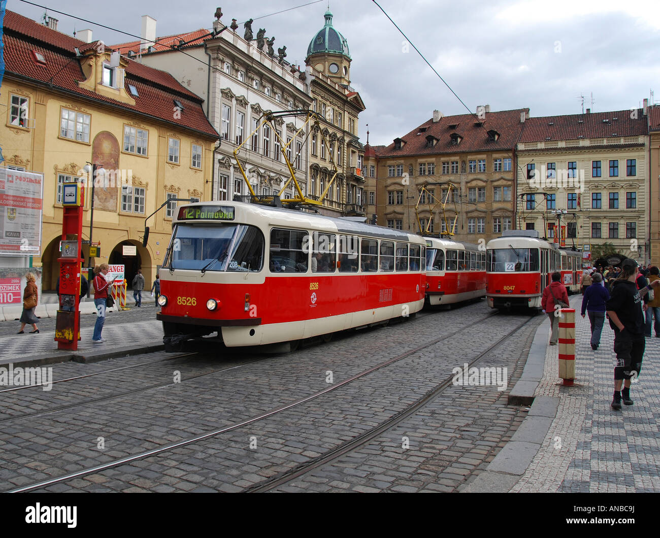 Trams run through cobbled streets in the Old Town of Prague, Czech ...
