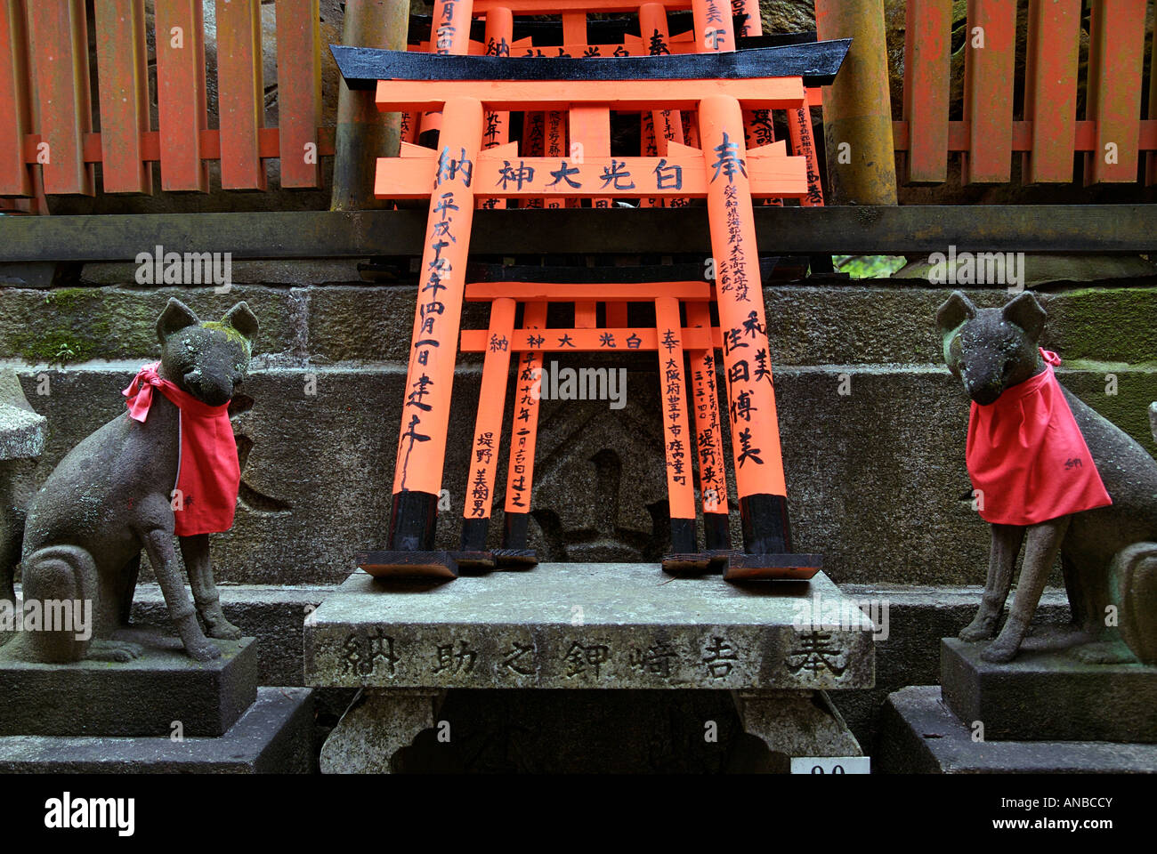 Stone sculptures of a fox with red bib Inari statue Fushimi Inari ...
