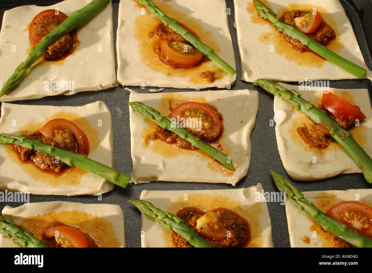 Puff pastry asparagus and pesto sauce starters waiting to go in the ...