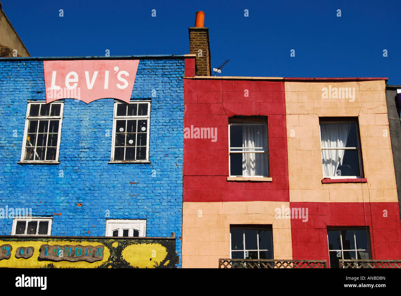 Brightly coloured shops in the sunshine at Camden High Street, London ...