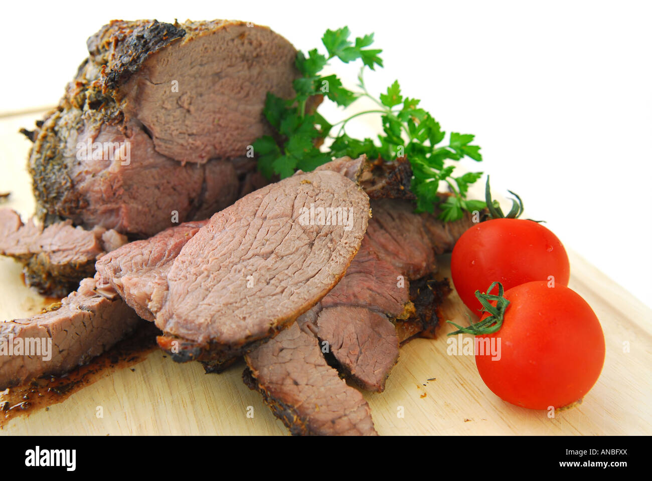 Beef roast cut on a cutting board Stock Photo - Alamy