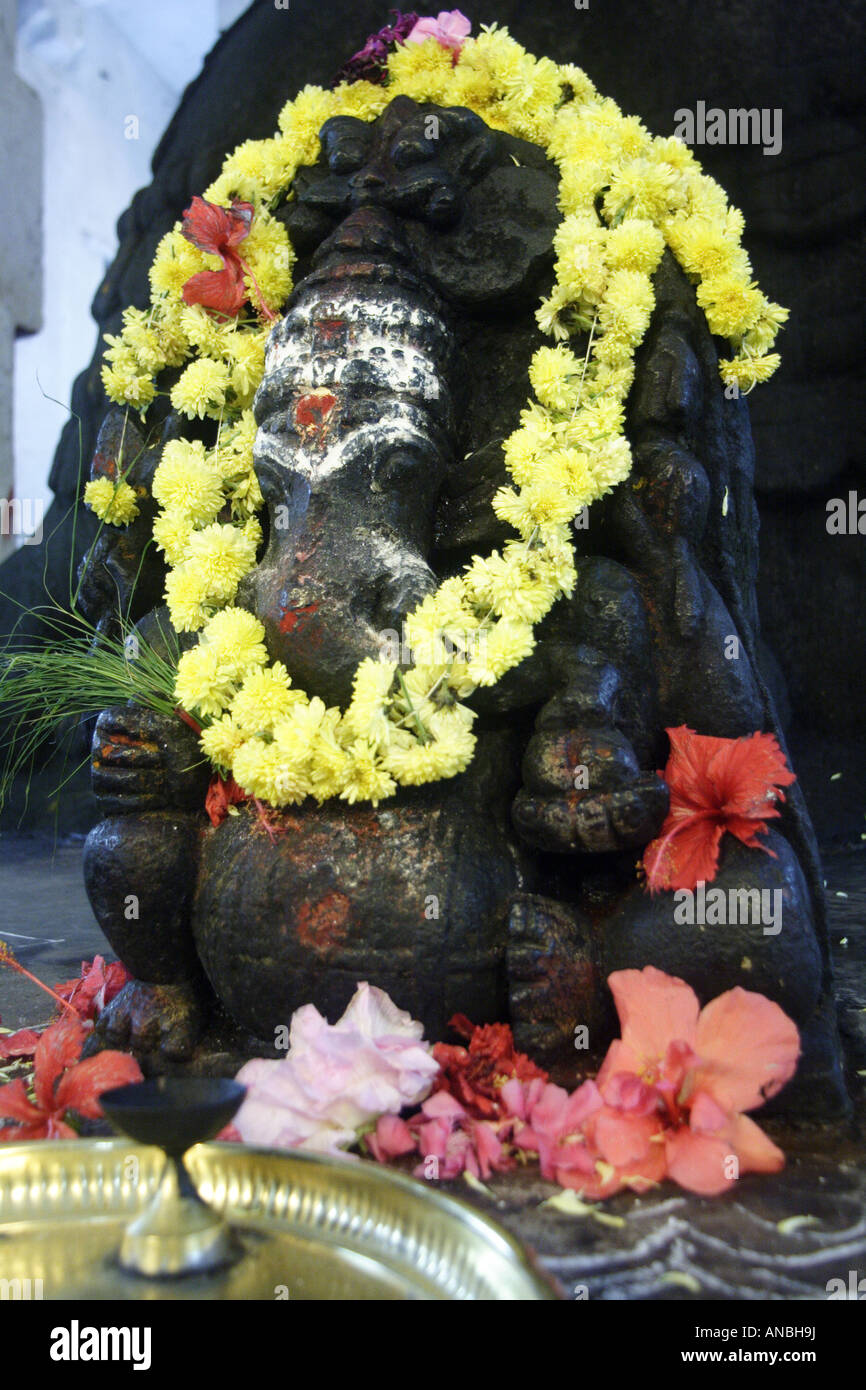 A garlanded statue of Ganesha in the Bull Temple in the Basavanagudi ...