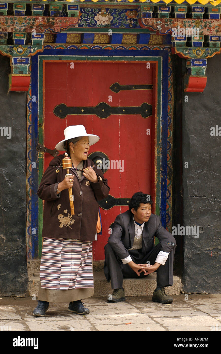 Tibetan woman with prayerwheel at Summer Palace Lhasa Tibet Stock Photo ...