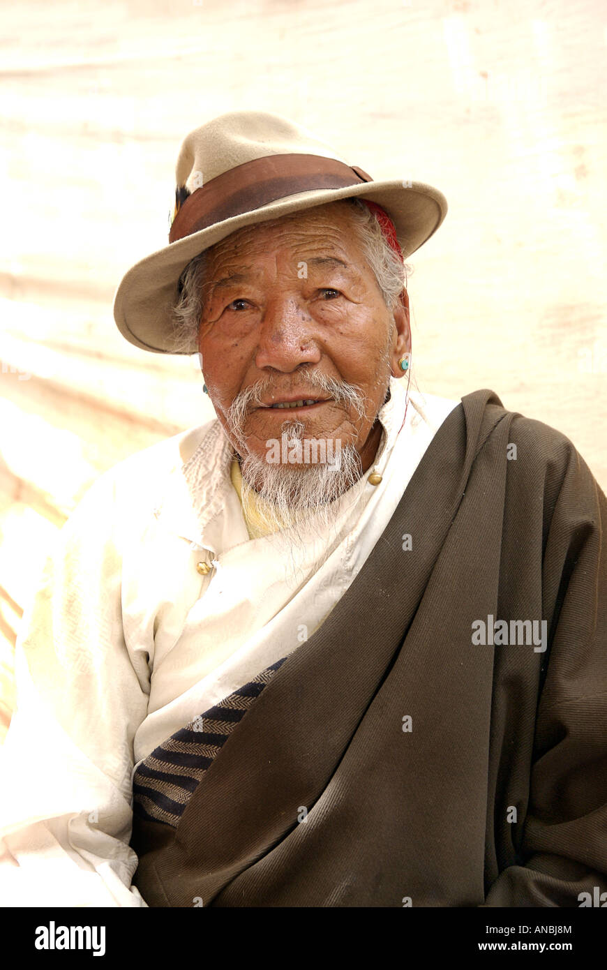 Elderly Tibetan man in traditional costume Lhasa Tibet Stock Photo - Alamy