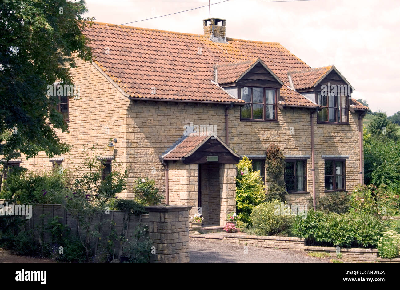 Modern 1983 imitation hamstone house hi-res stock photography and ...