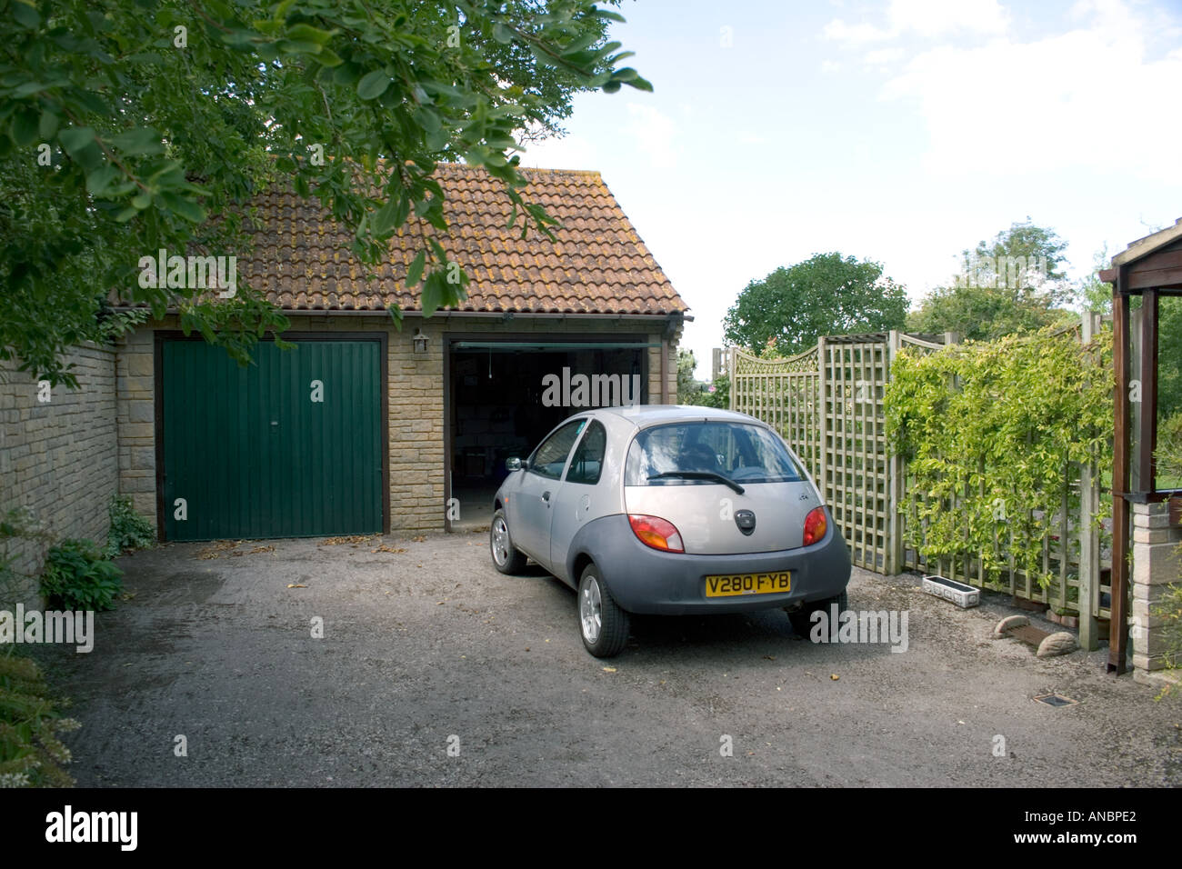 car and double garage Stock Photo - Alamy