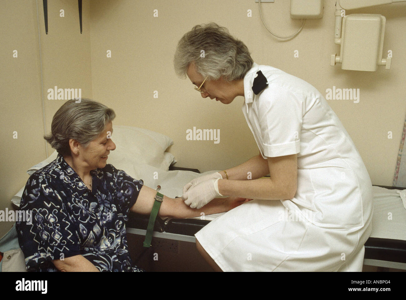 nurse taking a blood sample Stock Photo - Alamy