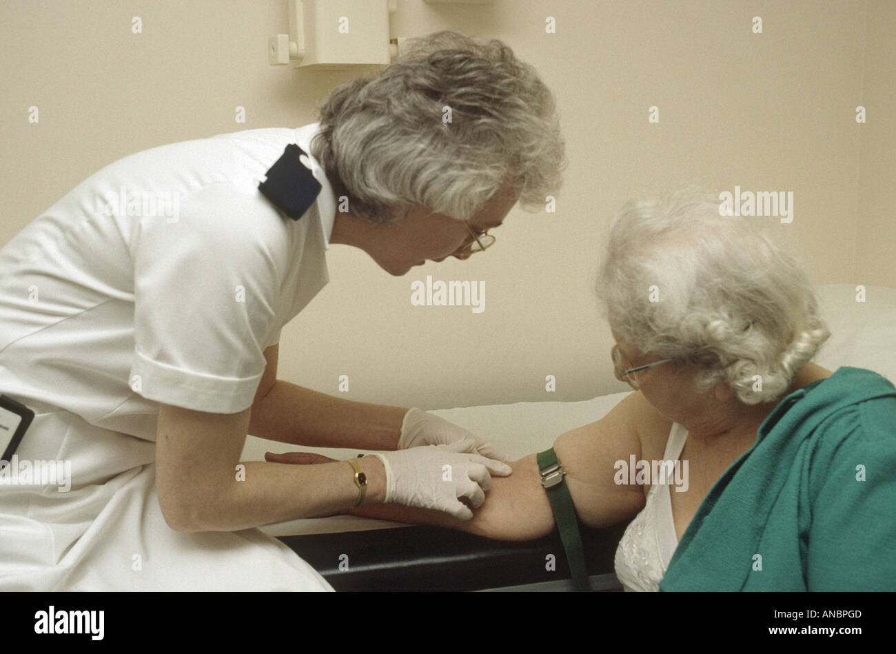 nurse taking a blood sample Stock Photo - Alamy
