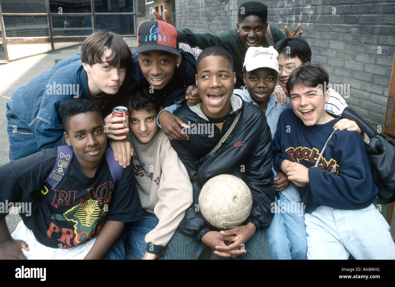 Secondary school playground scene with group of boys Stock Photo - Alamy