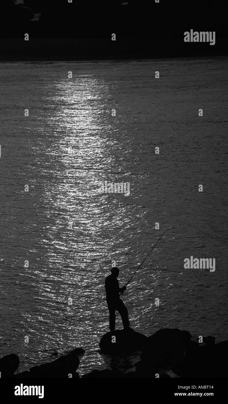 Fishing from rocks Black and White Stock Photos & Images - Alamy