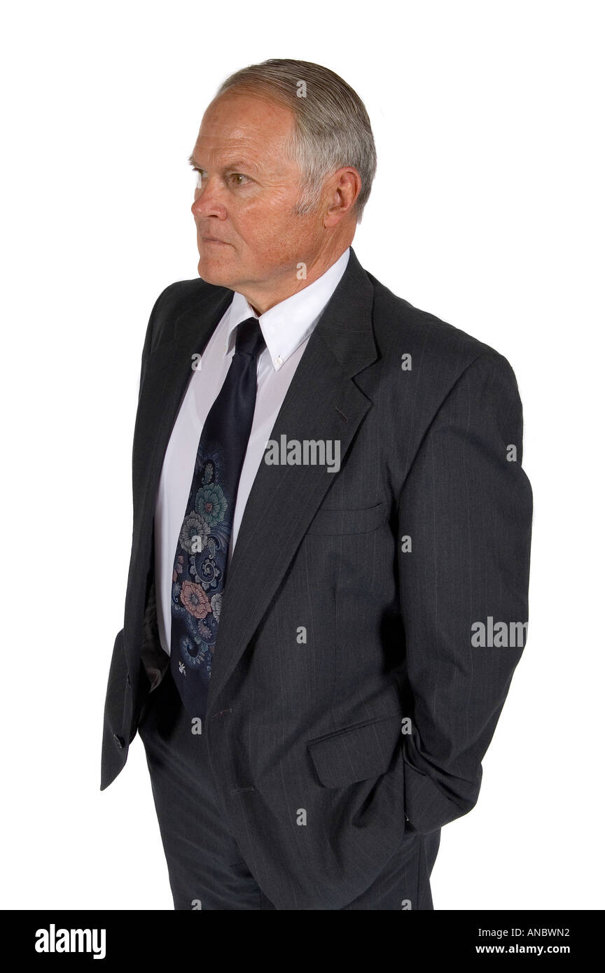 Medium shot of an executive looking off camera with a serious look on ...