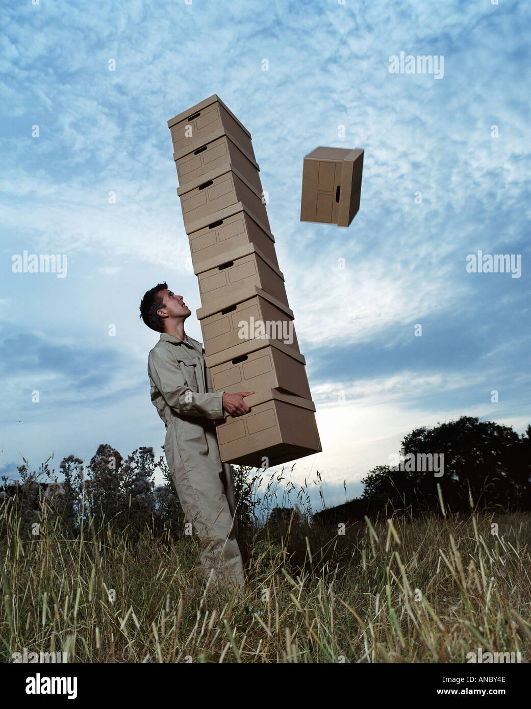Man pile boxes one falling hi-res stock photography and images - Alamy