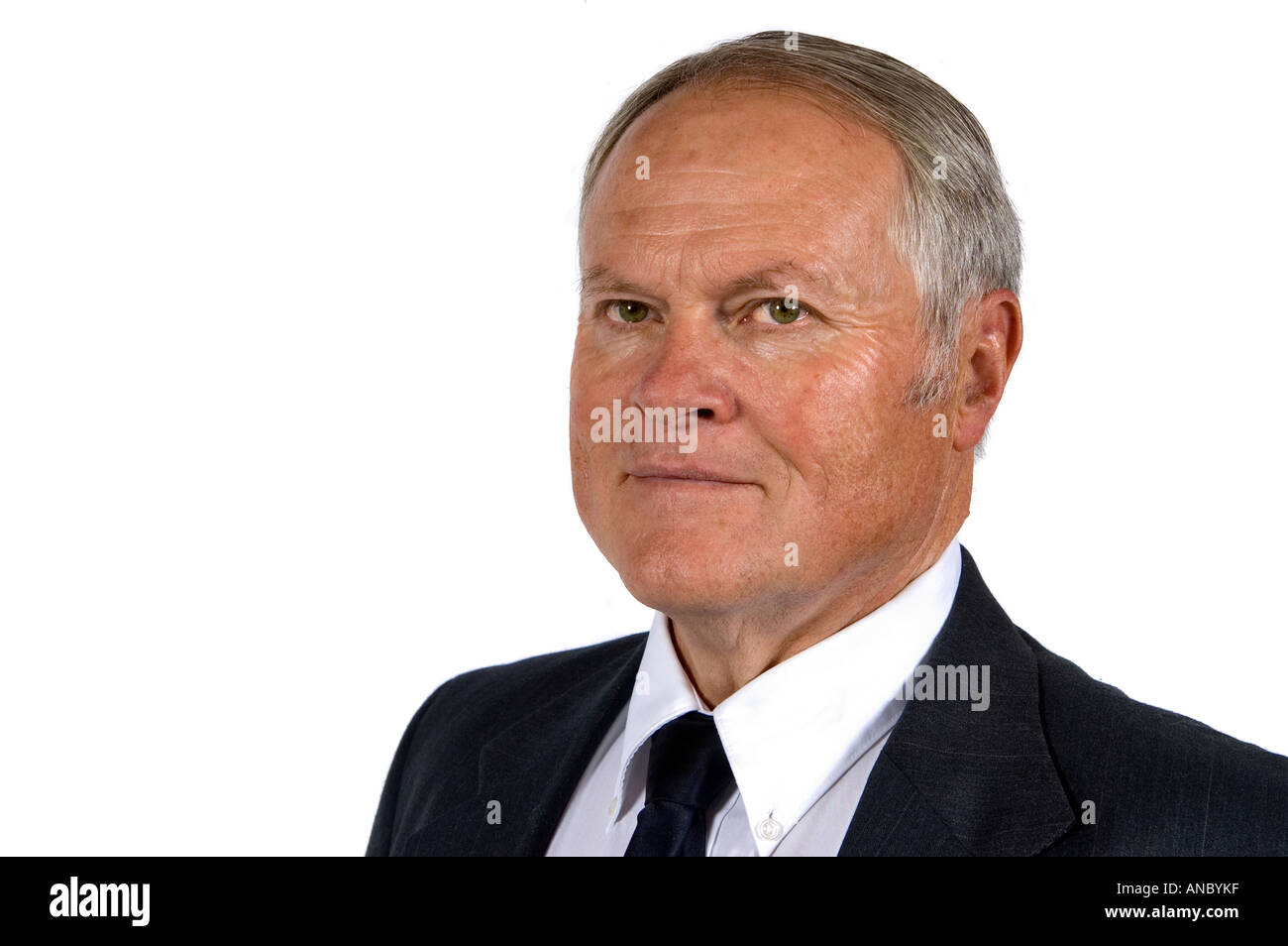 Executive in a tight shot looking straight at camera with a slight ...