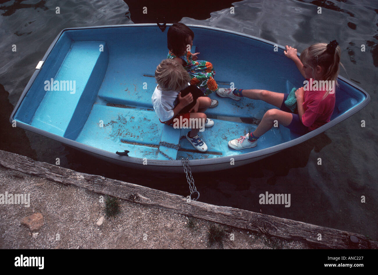 Children rowing boat hi-res stock photography and images - Alamy