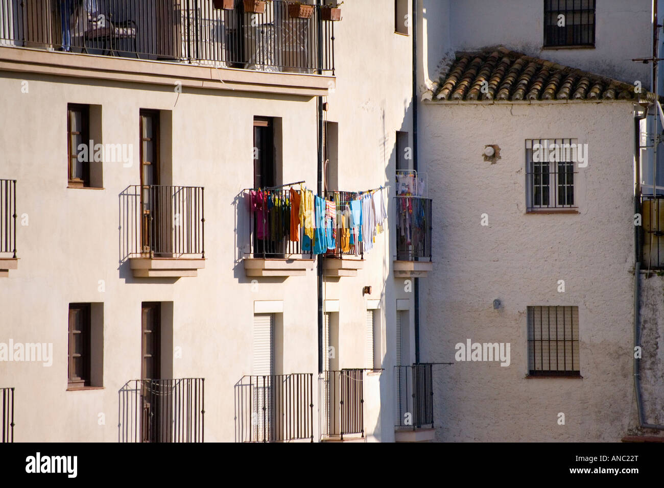 Laundry on washing line on balconies of Spanish apartment building ...
