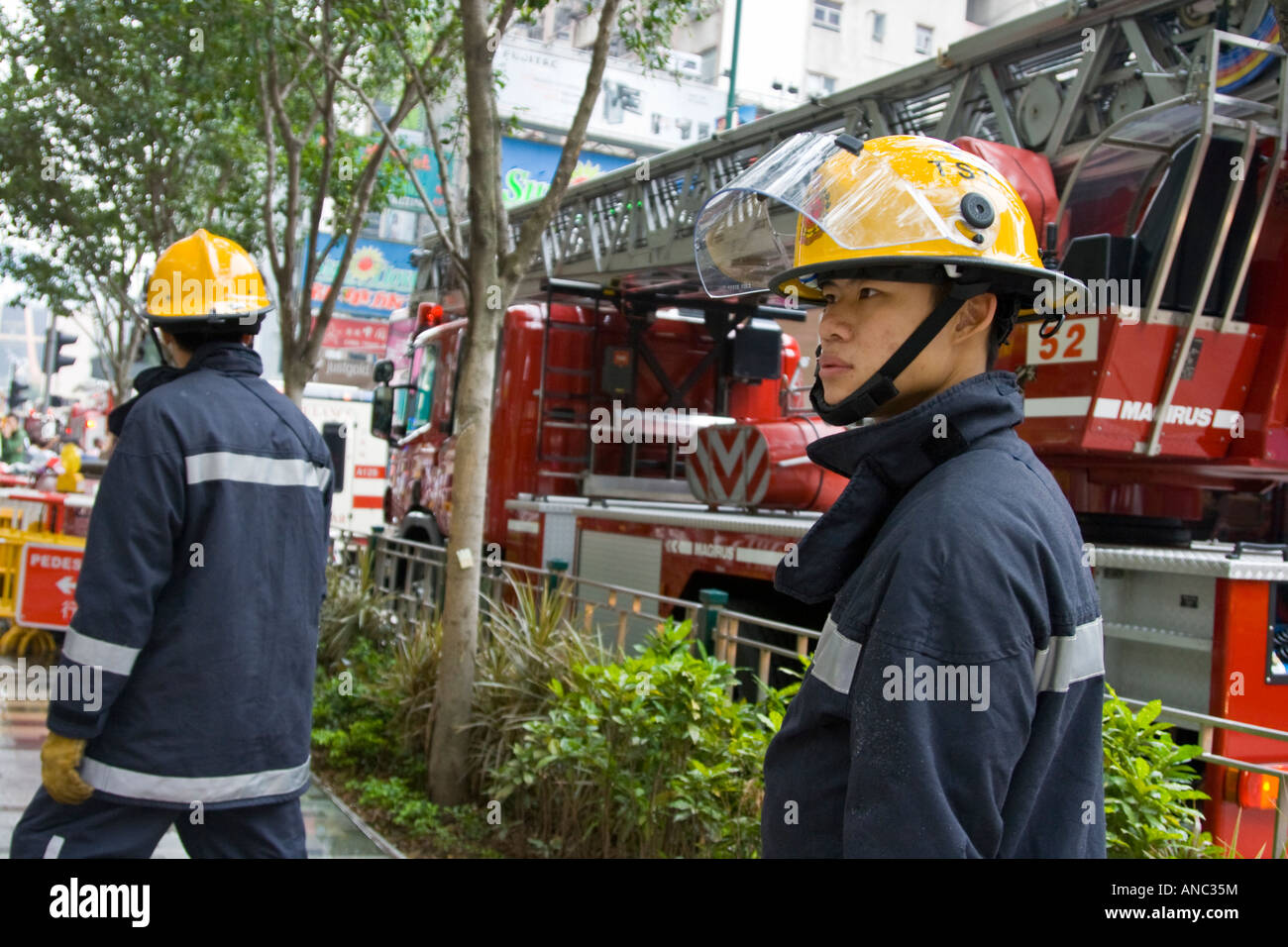 Firefighters and Fire Engine Truck Hong Kong SAR Stock Photo - Alamy