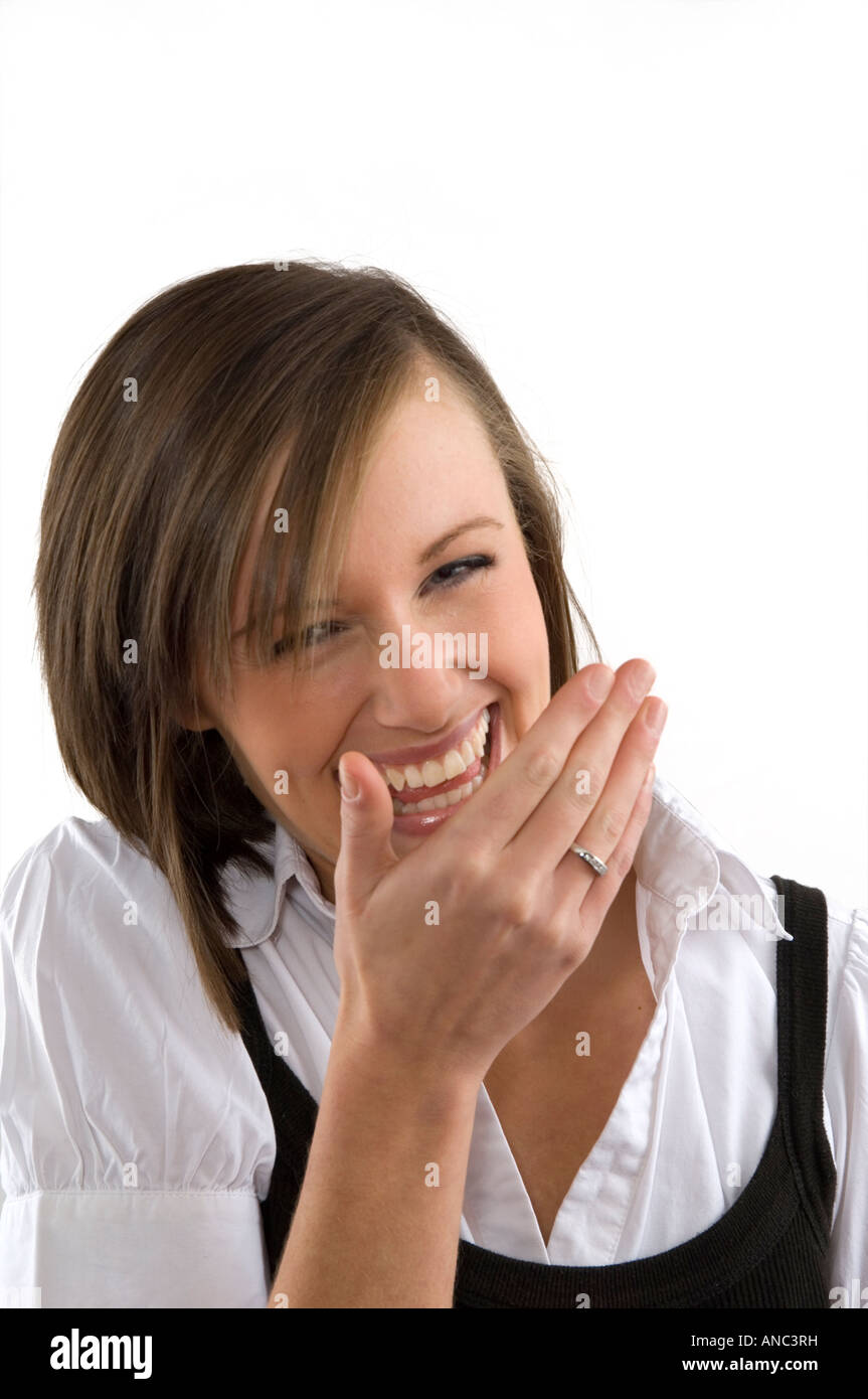 woman laughing with hand in front of her mouth Stock Photo - Alamy