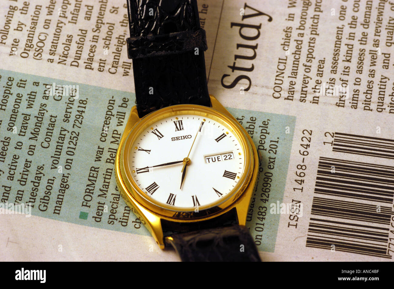Watch and paper Stock Photo - Alamy