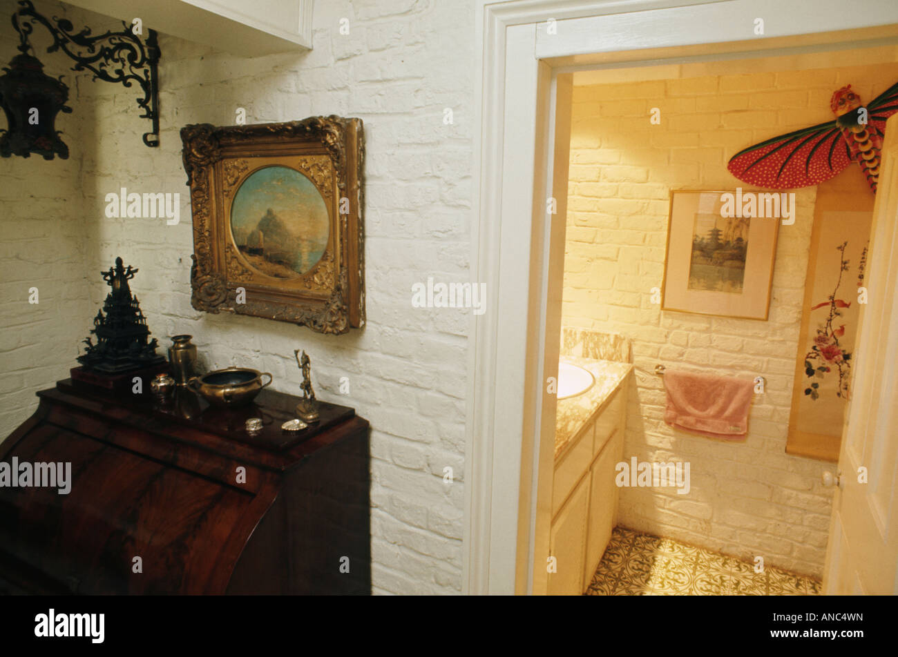 Victorian painting on white unplastered wall in small hall in cottage ...