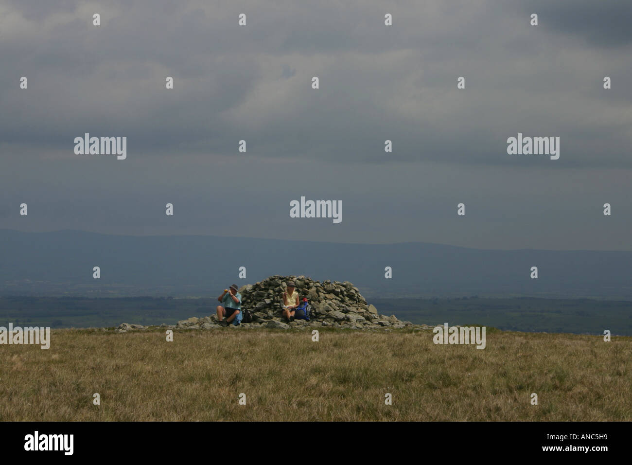 A couple at the summit of Selside Pike above Swindale in the Eastern ...