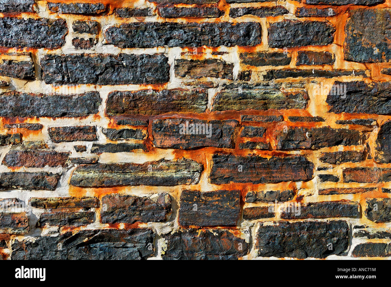 Rusty Stone Wall Stock Photo - Alamy