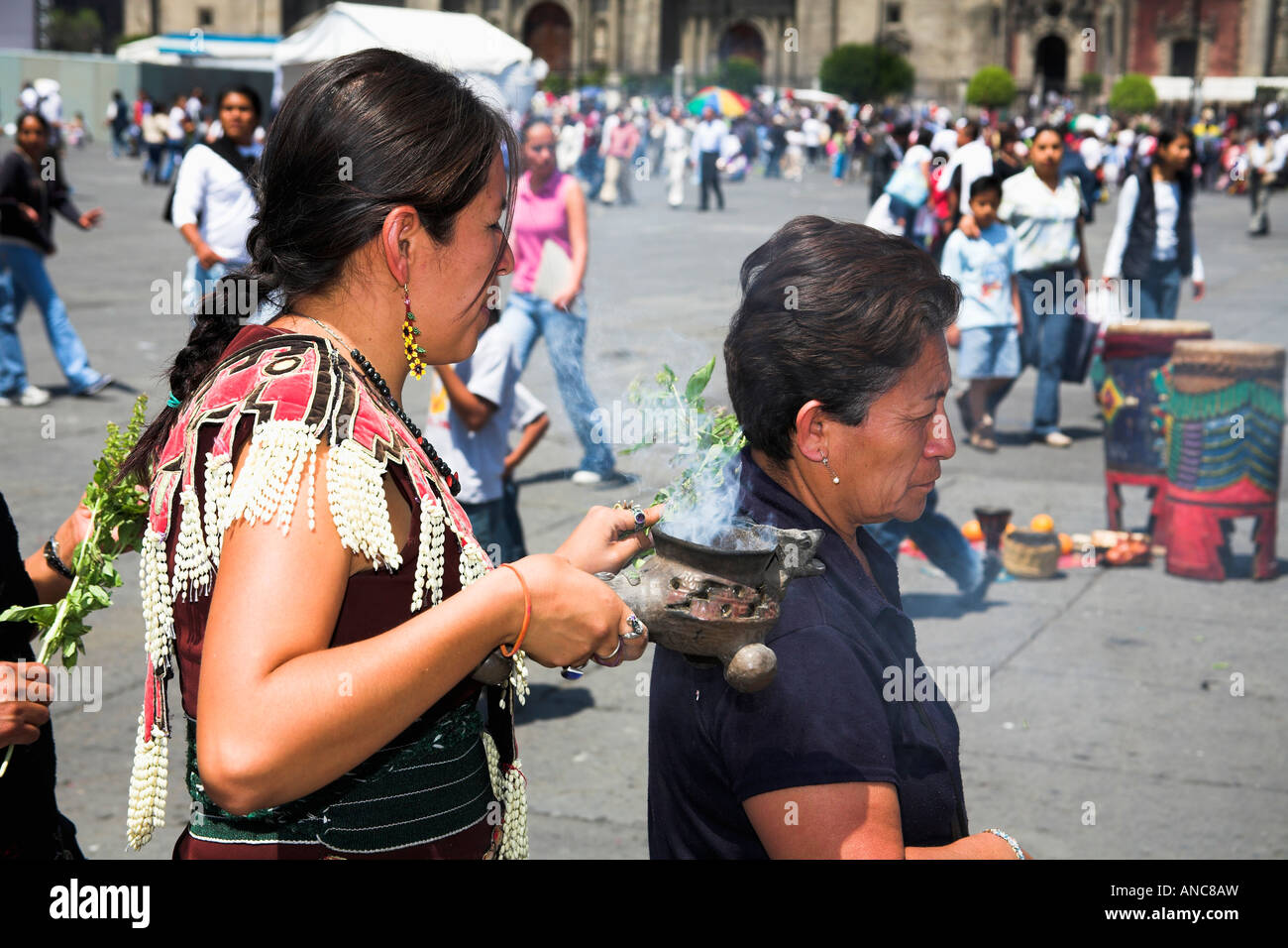 Female Mexican Indian practising traditional religious healing ceremony ...