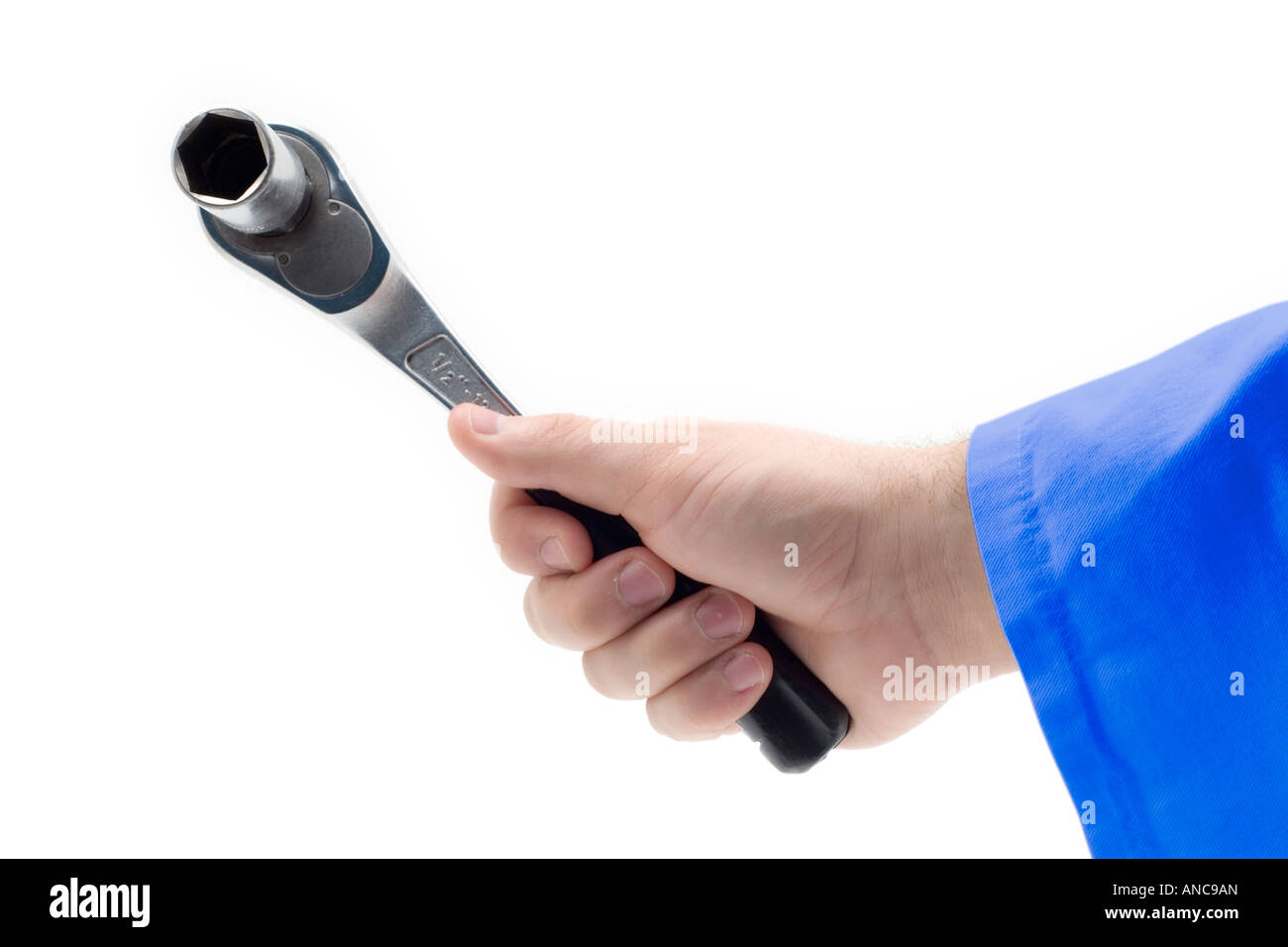 Worker holding a wrench Stock Photo - Alamy