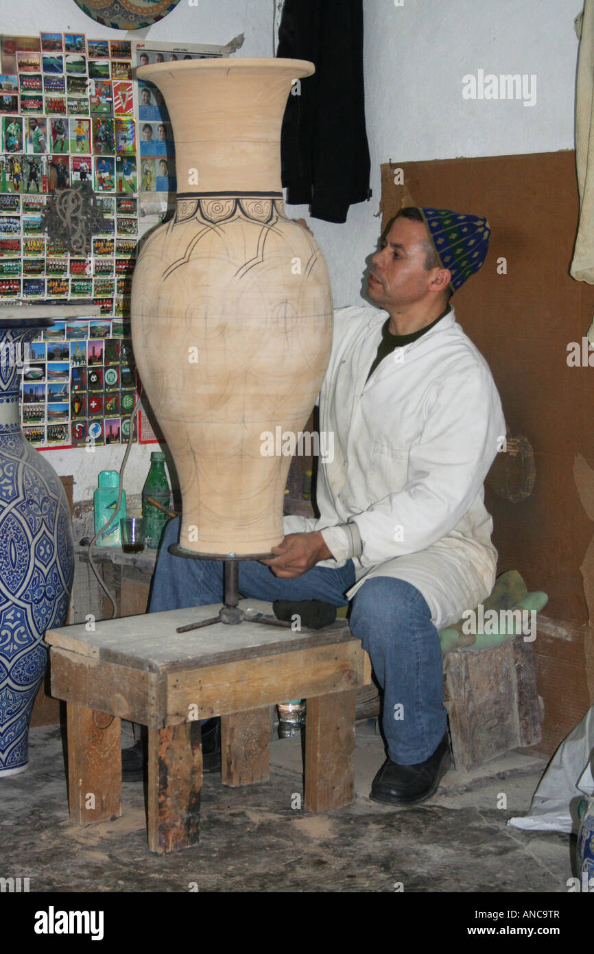 Man decorating pottery hi-res stock photography and images - Alamy