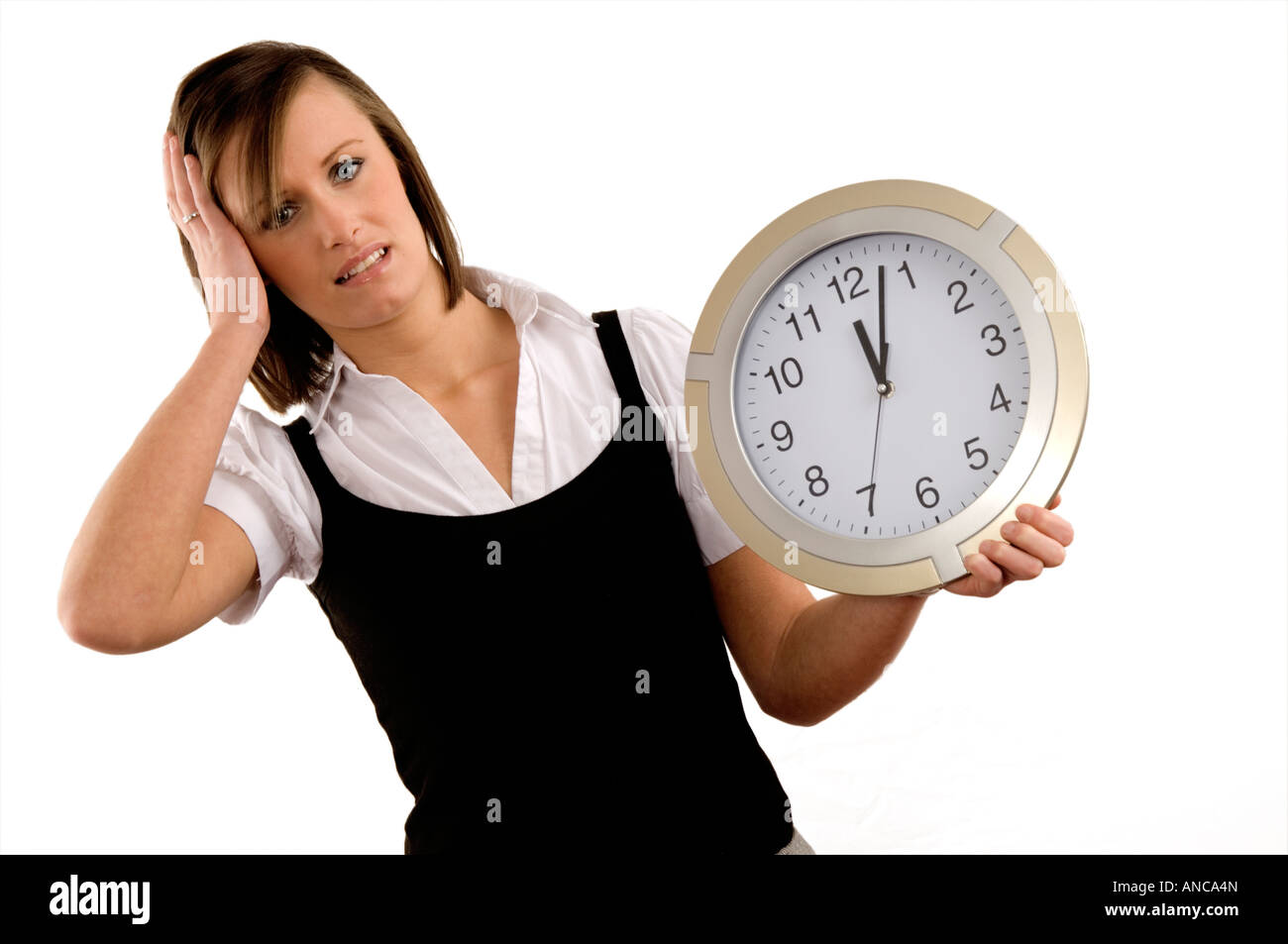 woman looking stressed holding a clock missed deadline Stock Photo - Alamy