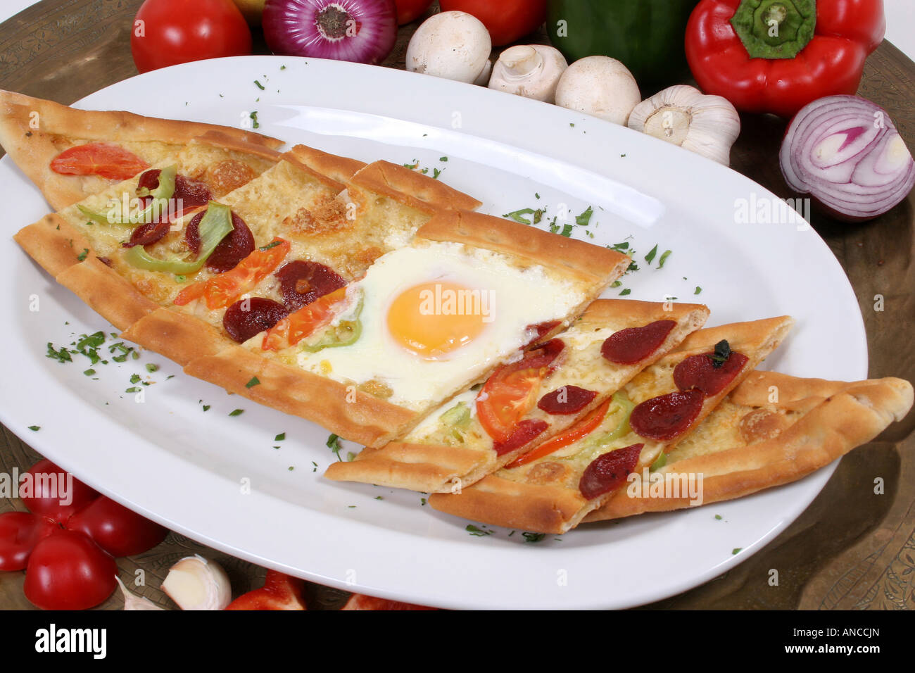 Turkish pide with Turkish sausage and egg Stock Photo - Alamy