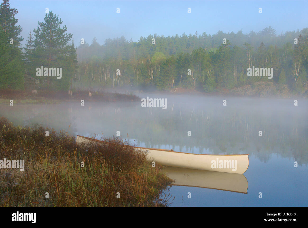 Scene with canoe Stock Photo - Alamy