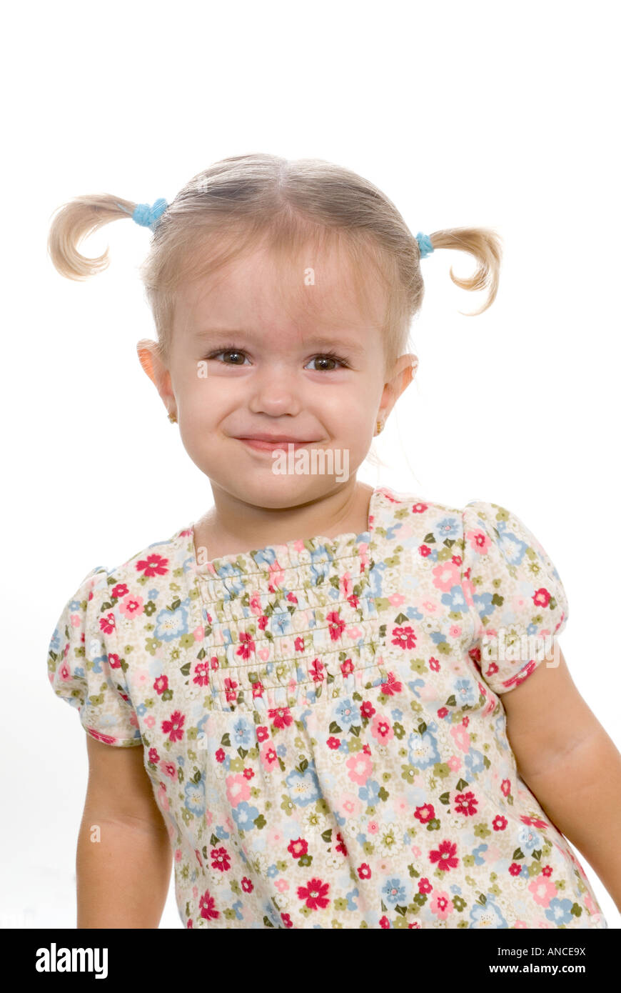 portrait of a happy baby girl with piggy tales Stock Photo - Alamy