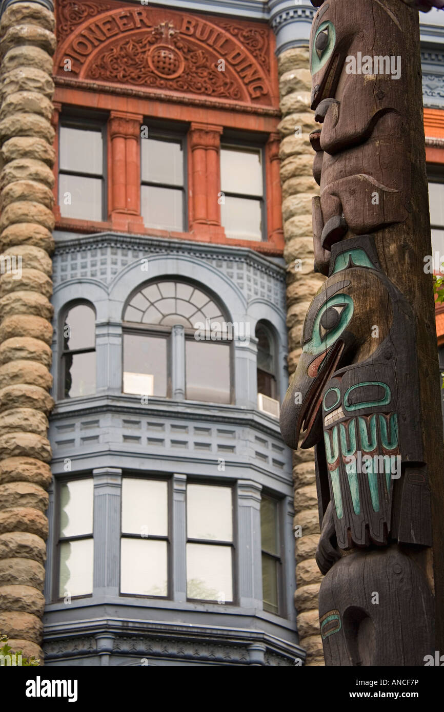 WA, Seattle, Totem pole and Pioneer building at historic Pioneer Square ...