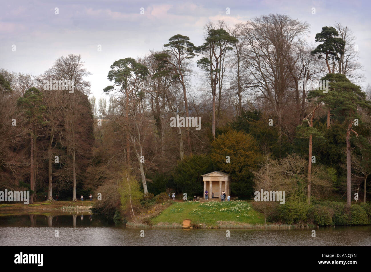 VISITORS IN THE GROUNDS OF BOWOOD HOUSE EXPLORE THE DORIC TEMPLE WHICH ...