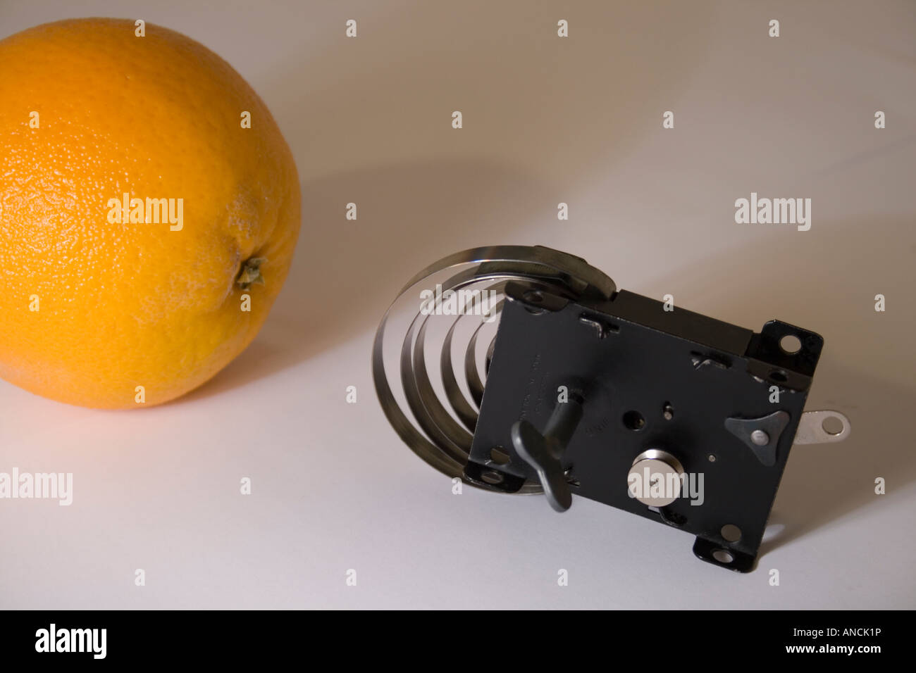 Orange and Clockwork Motor Stock Photo - Alamy