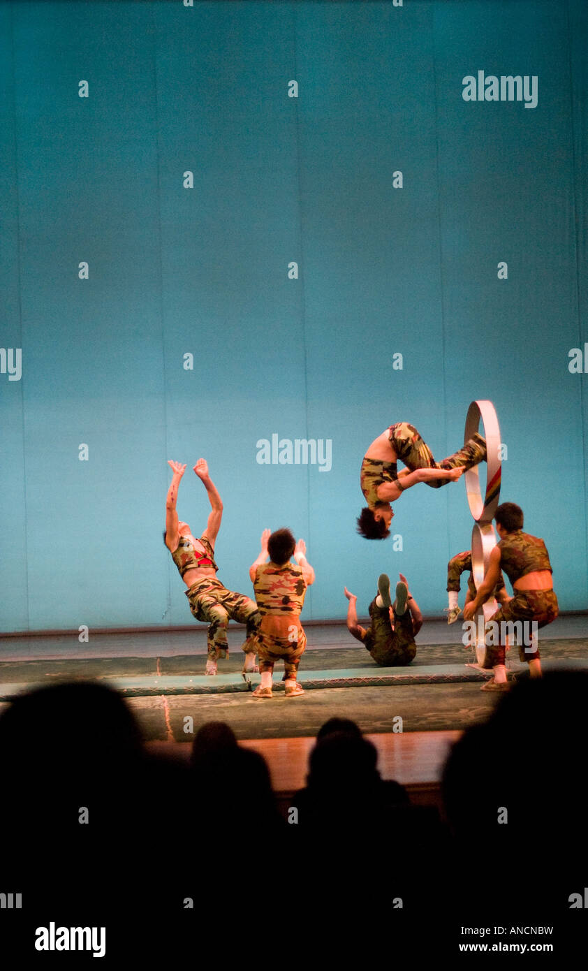 Male acrobats perfoming together in Chaoyang theater, Beijing, China ...