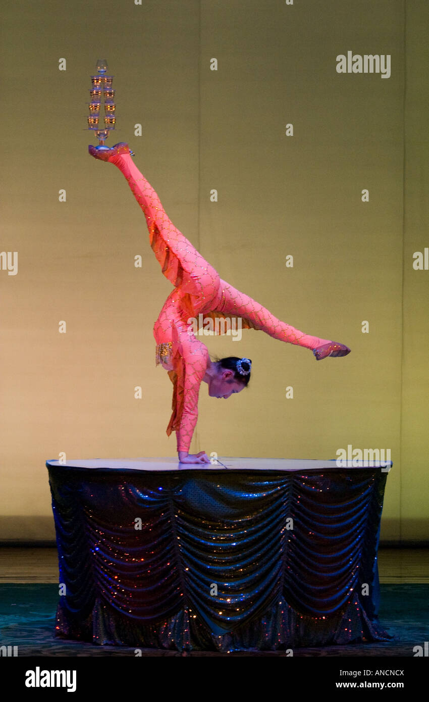 Female acrobat performing with glasses, Beijing, China Stock Photo - Alamy