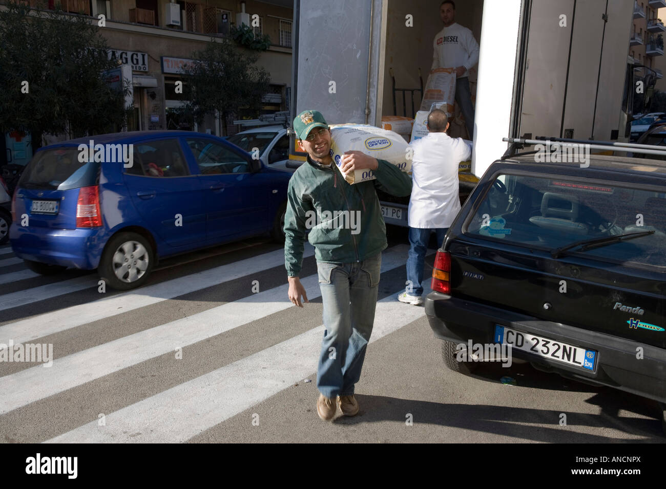Italy Rome Delivery man in Rome in early morning Stock Photo - Alamy