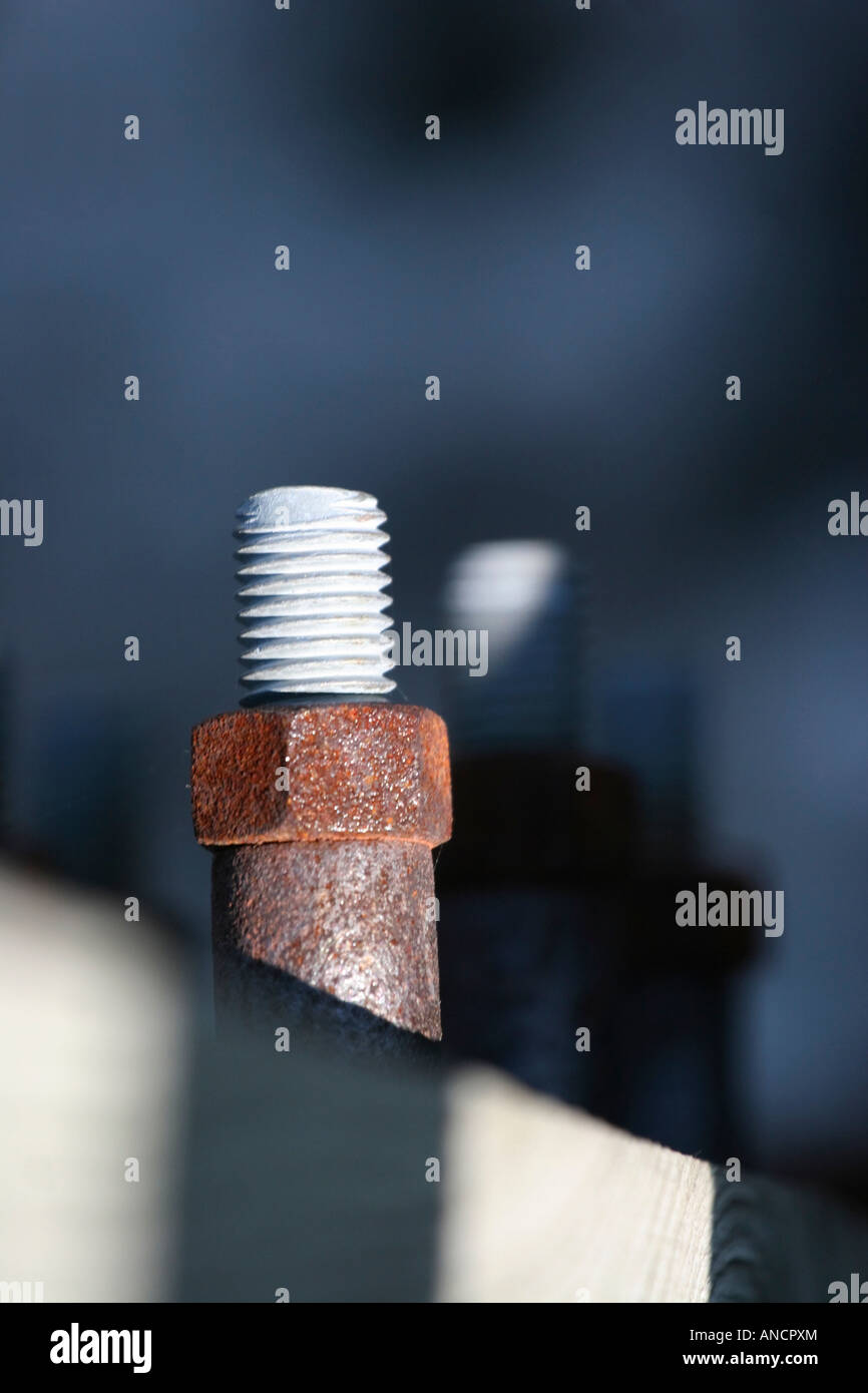 Rusty metal bolts nobody close up closeup blurry blurred background low ...