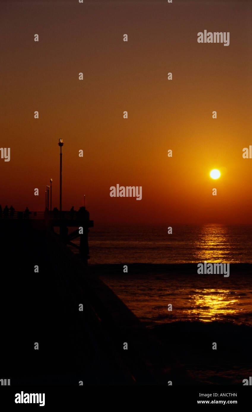 Pier at sunset Stock Photo - Alamy