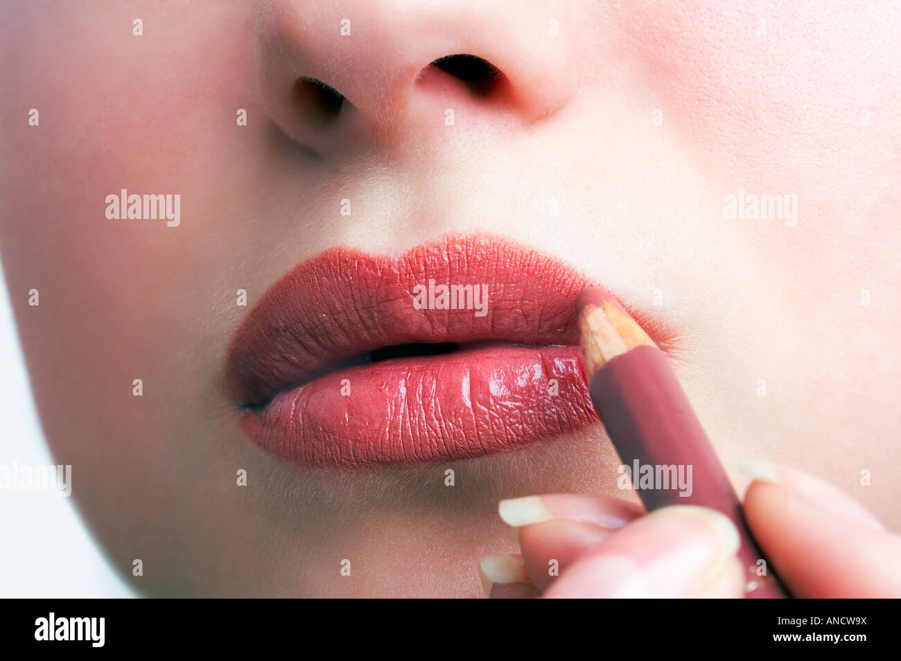 woman tracing lip contour of beautiful full lips Stock Photo - Alamy