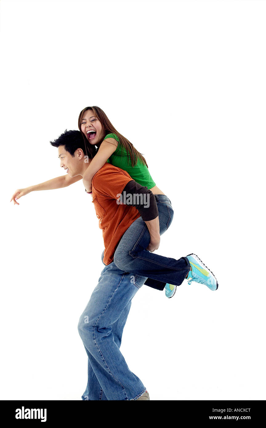 Young Couple Piggyback Stock Photo - Alamy