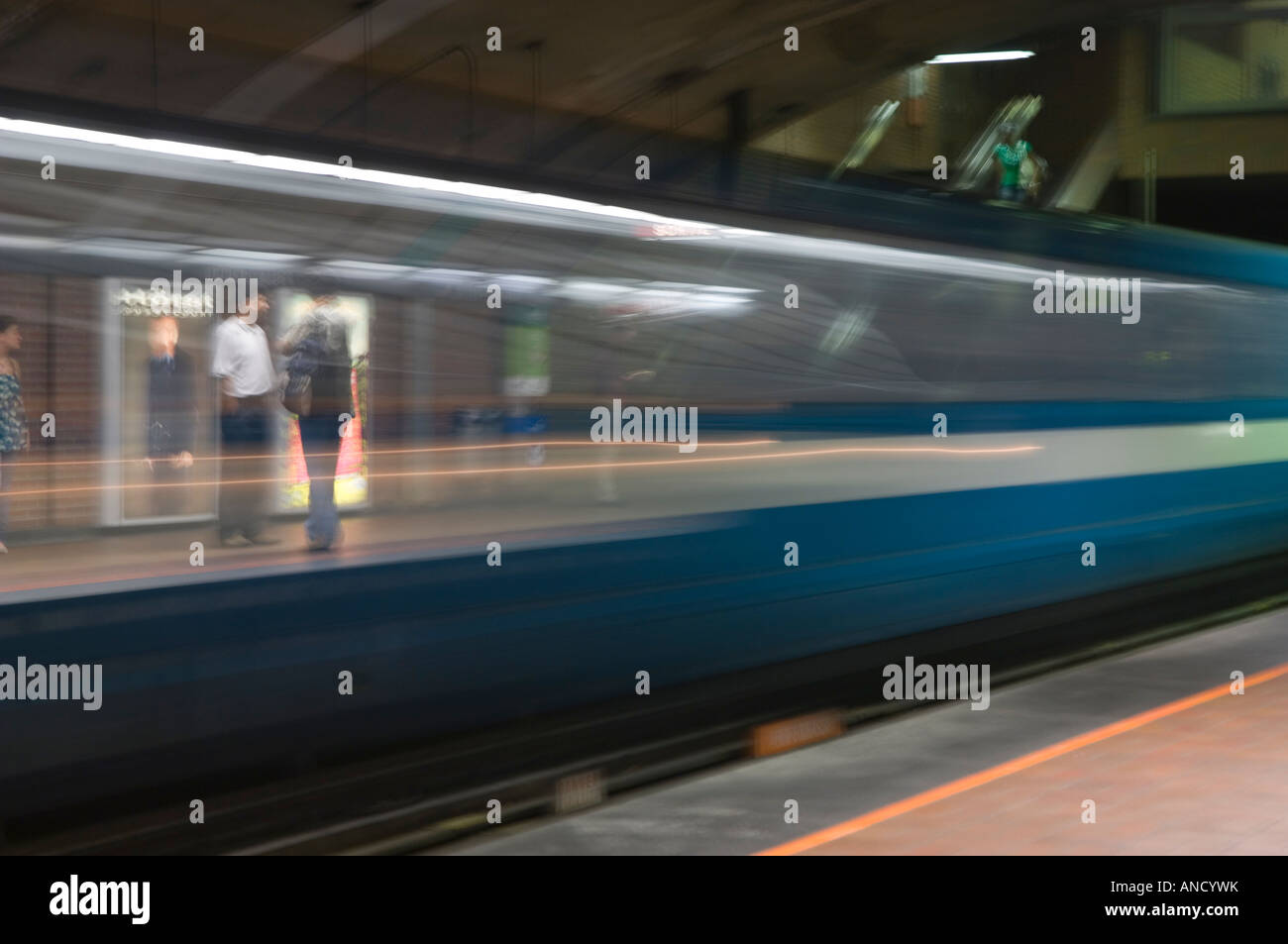A train speeds into the station on the Montreal metro underground ...