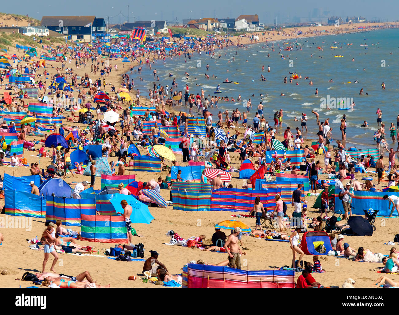 The crowded beach of Camber Sands in the height of the summer holiday ...