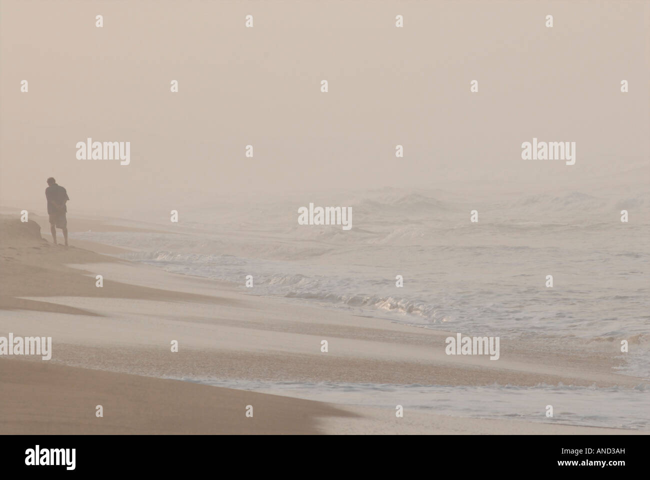 Distant figure on shoreline hi-res stock photography and images - Alamy