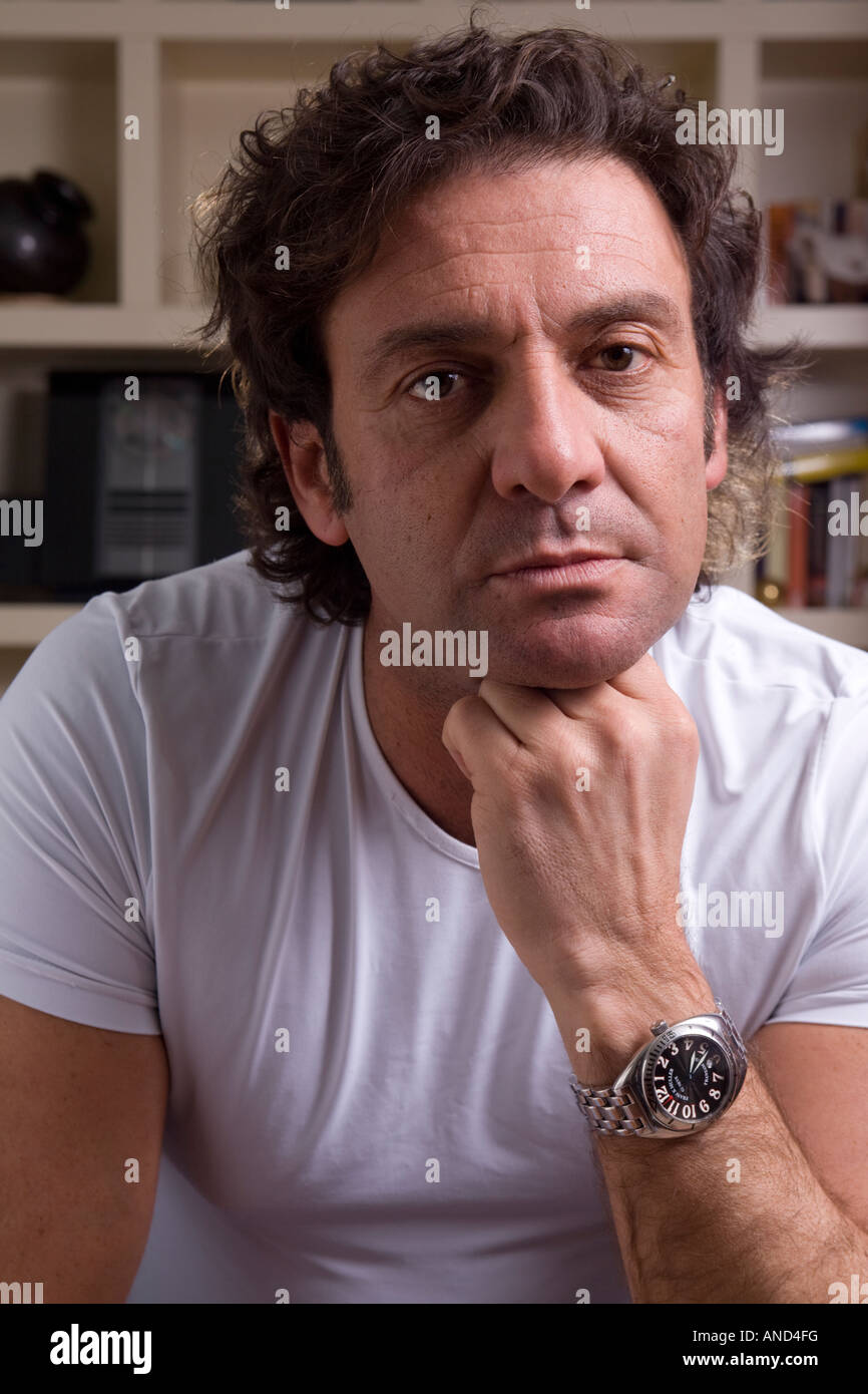 Headshot of a middle aged man in a pensive mood Stock Photo - Alamy