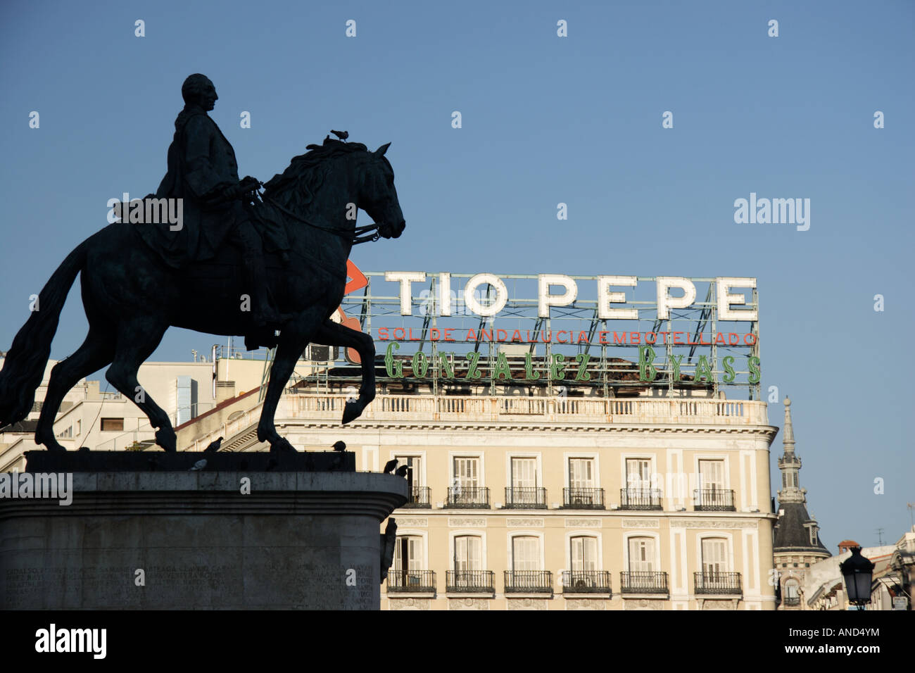 Famous Tio Pepe sign at Puerta del Sol and equestrian statue of Carlos ...